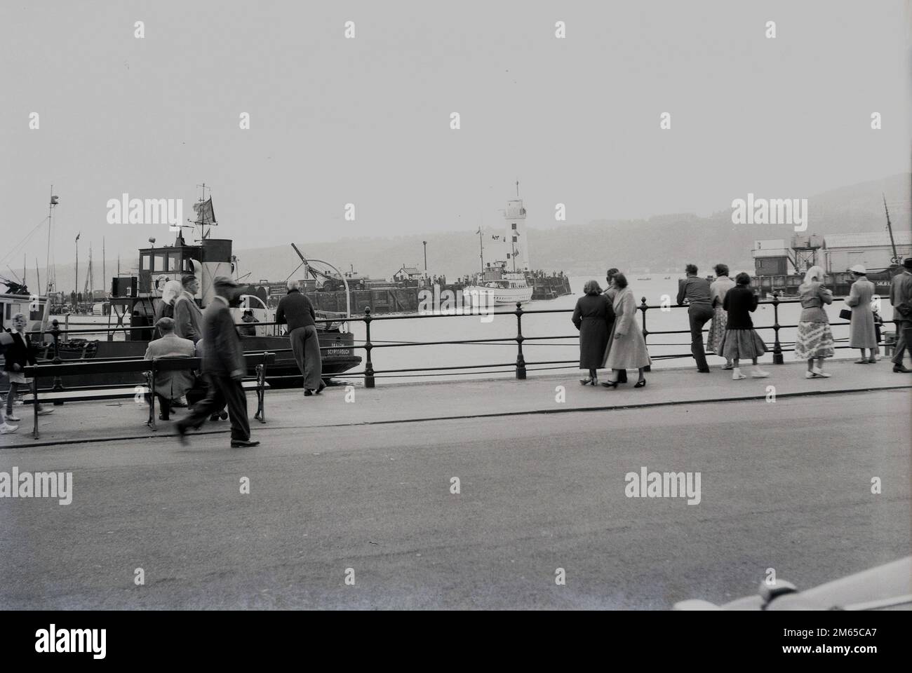 1950s, historical, people on a pavement at the harbour in Scarborough, a seaside resort, in East ...