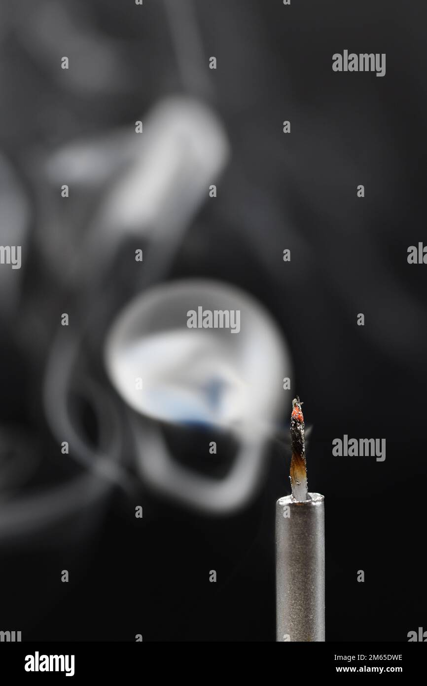 Smoking candle after it's been blown out with wispy smoke trail Stock ...