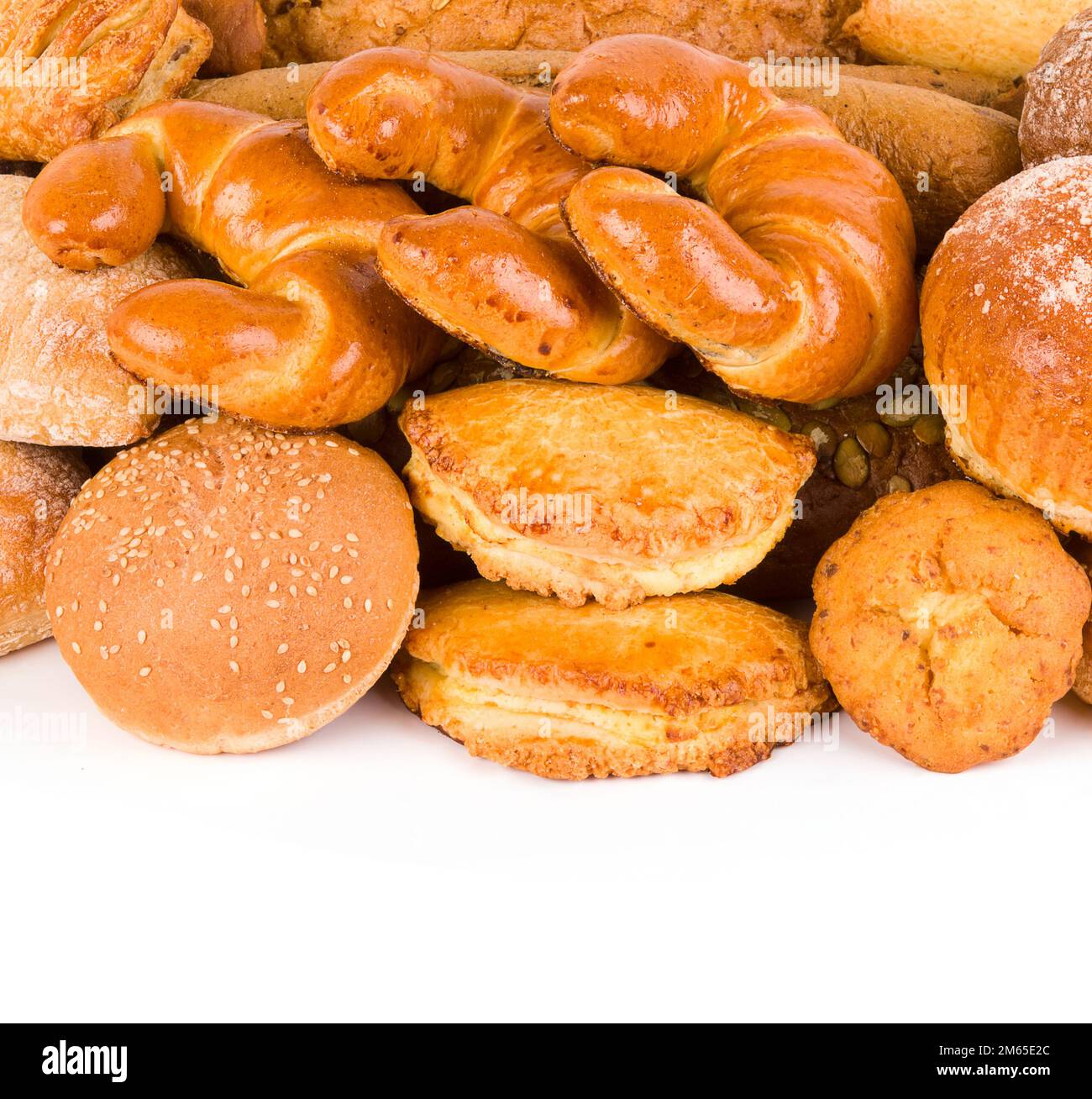 Croissants and sweet pastries isolated on white background. Free space ...