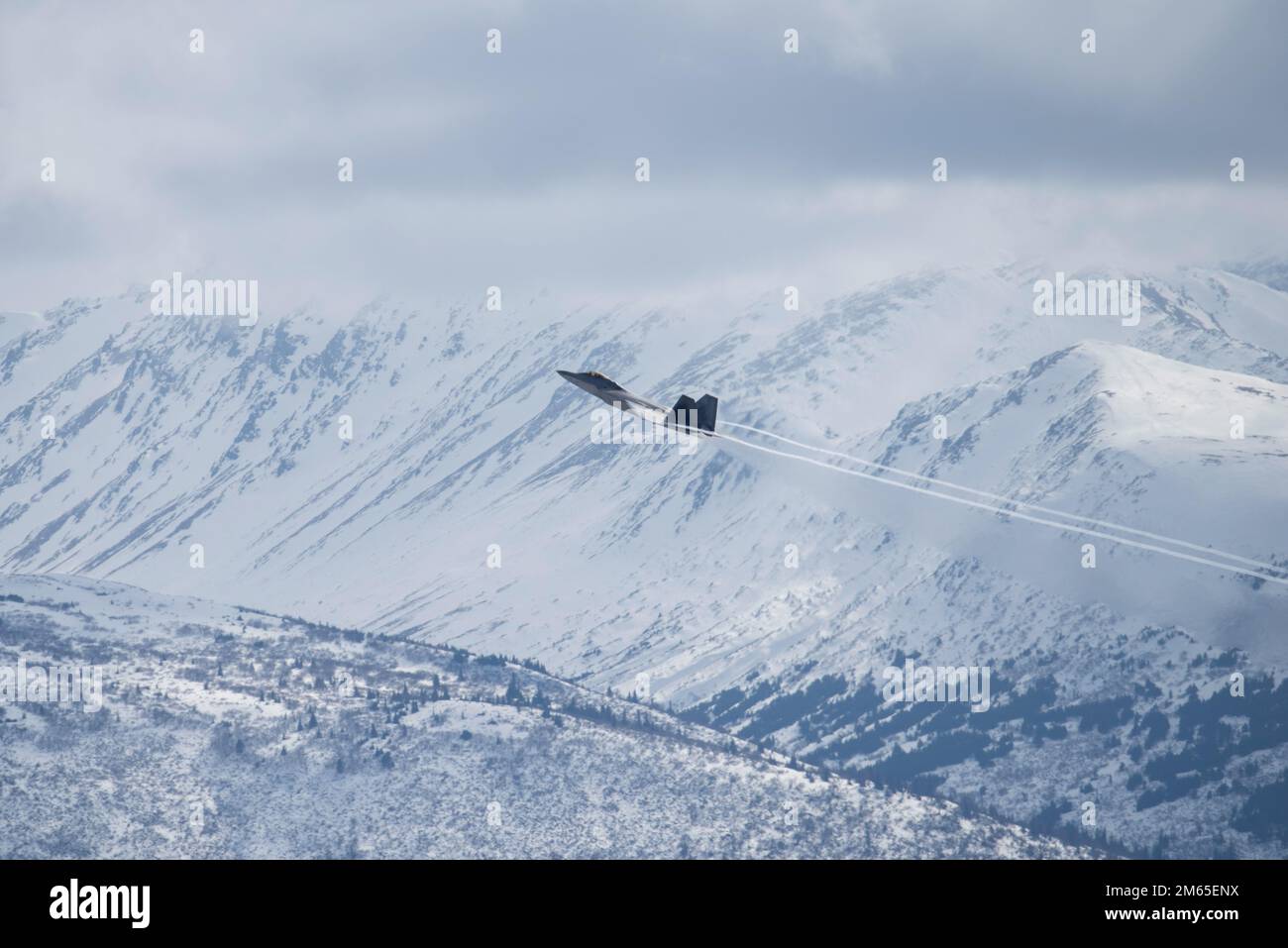 A U.S. Air Force F-22 Raptor assigned to the 3rd Wing flies over Joint ...