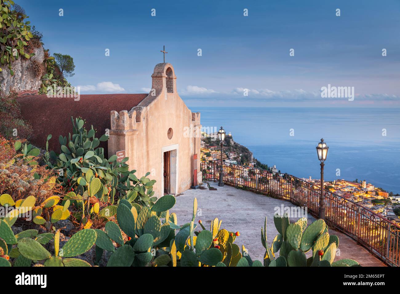 Taormina, Sicily, Italy with the ancient Church of San Biagio at dusk ...