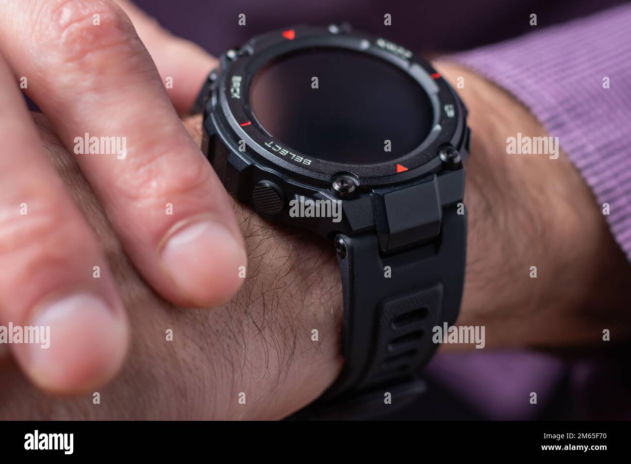 Close up shot of a man hand that uses a smart watch to view incoming ...