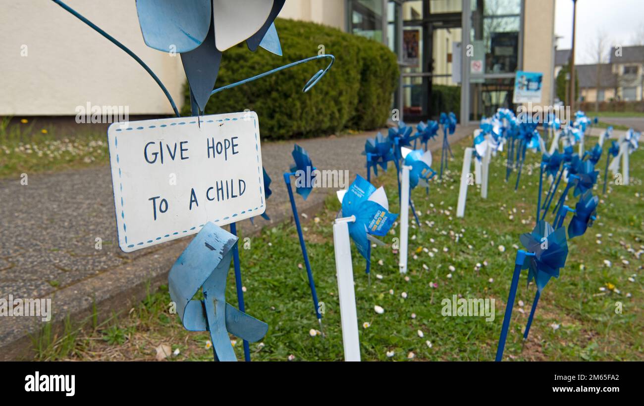 Pinwheels stand in front of the School Age Program building after a ...