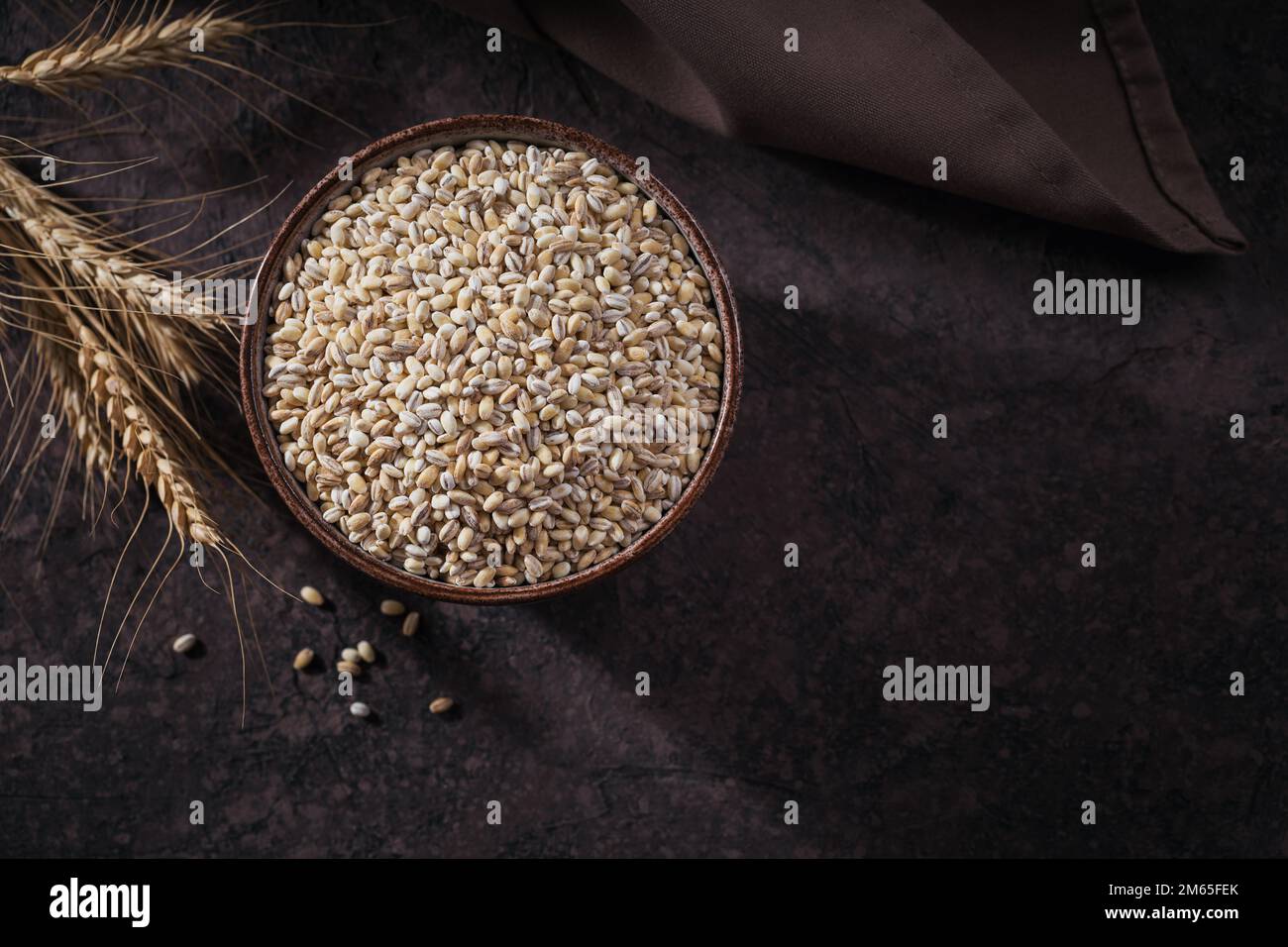 Bowl of raw dried broken pearl barley cereal grain Stock Photo - Alamy