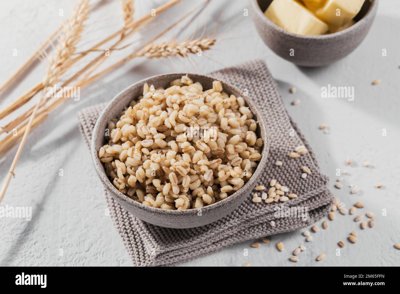 Bowl of cooked peeled barley grains porridge Stock Photo - Alamy