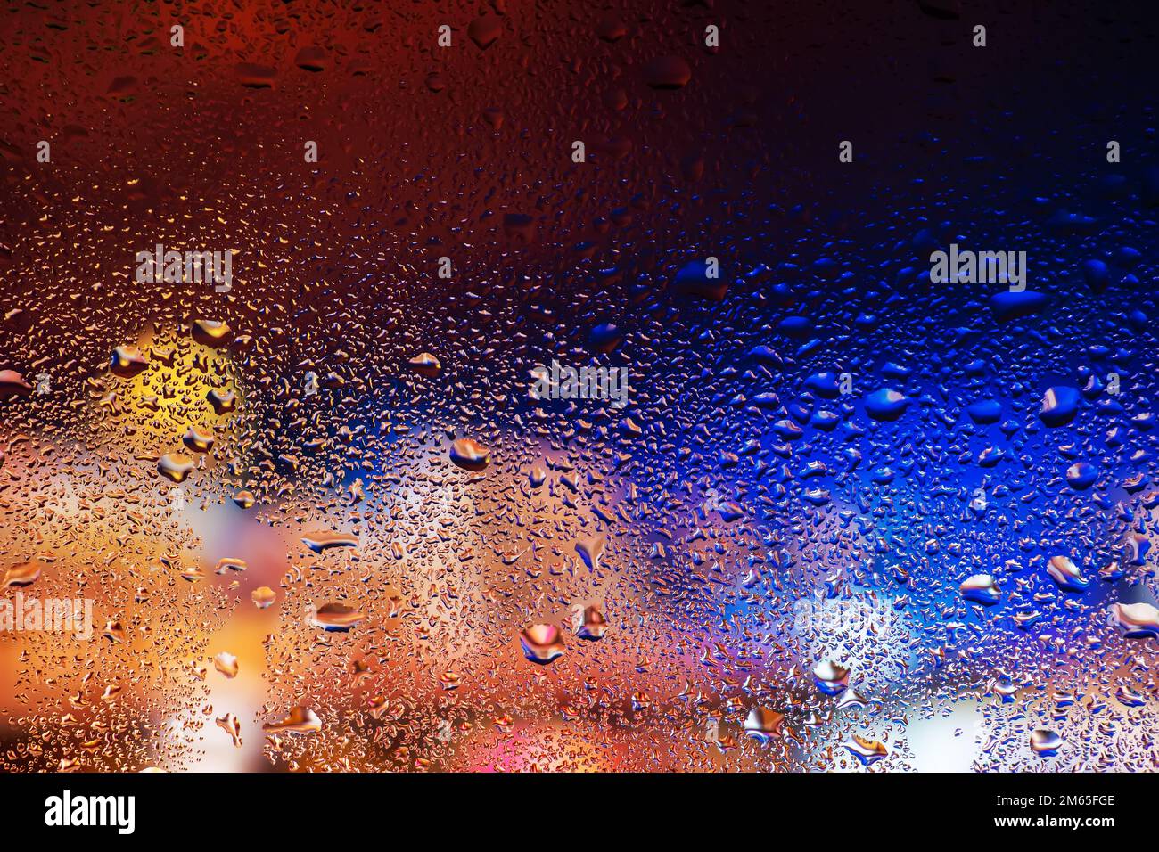 Water drops and condensation in a window glass. Abstract background ...