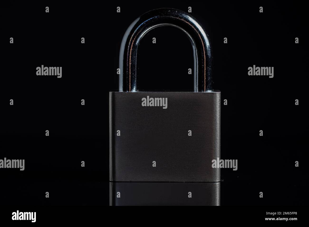 Steel padlock on the black textured background Stock Photo - Alamy
