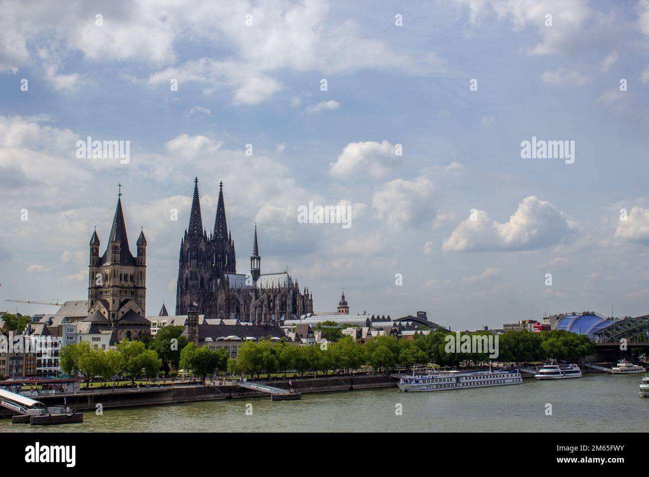 Cityscape of Cologne with Hohenzollern bridge, cathedral, Saint Martin ...