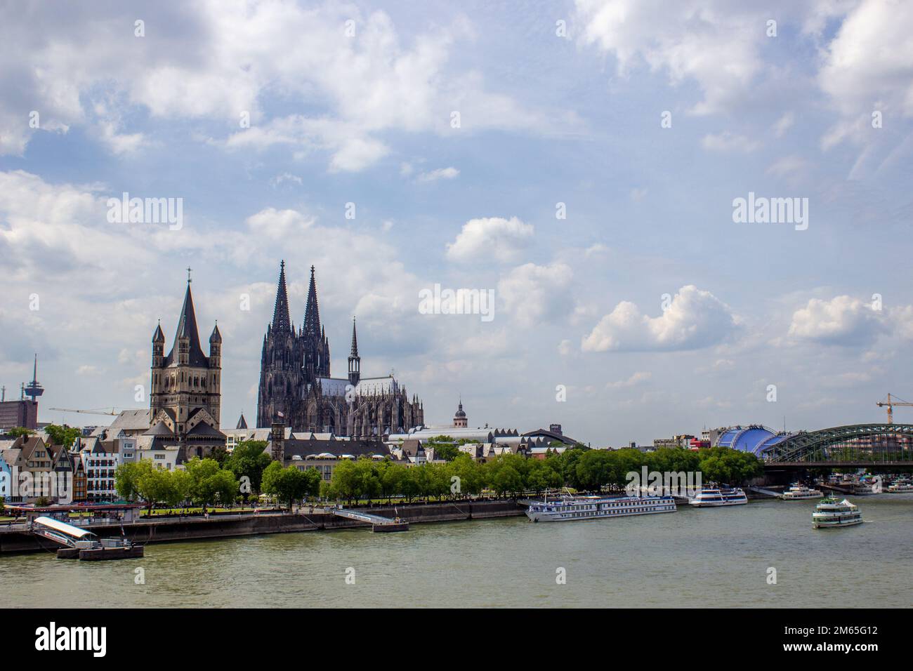 Cityscape of Cologne with Hohenzollern bridge, cathedral, Saint Martin ...