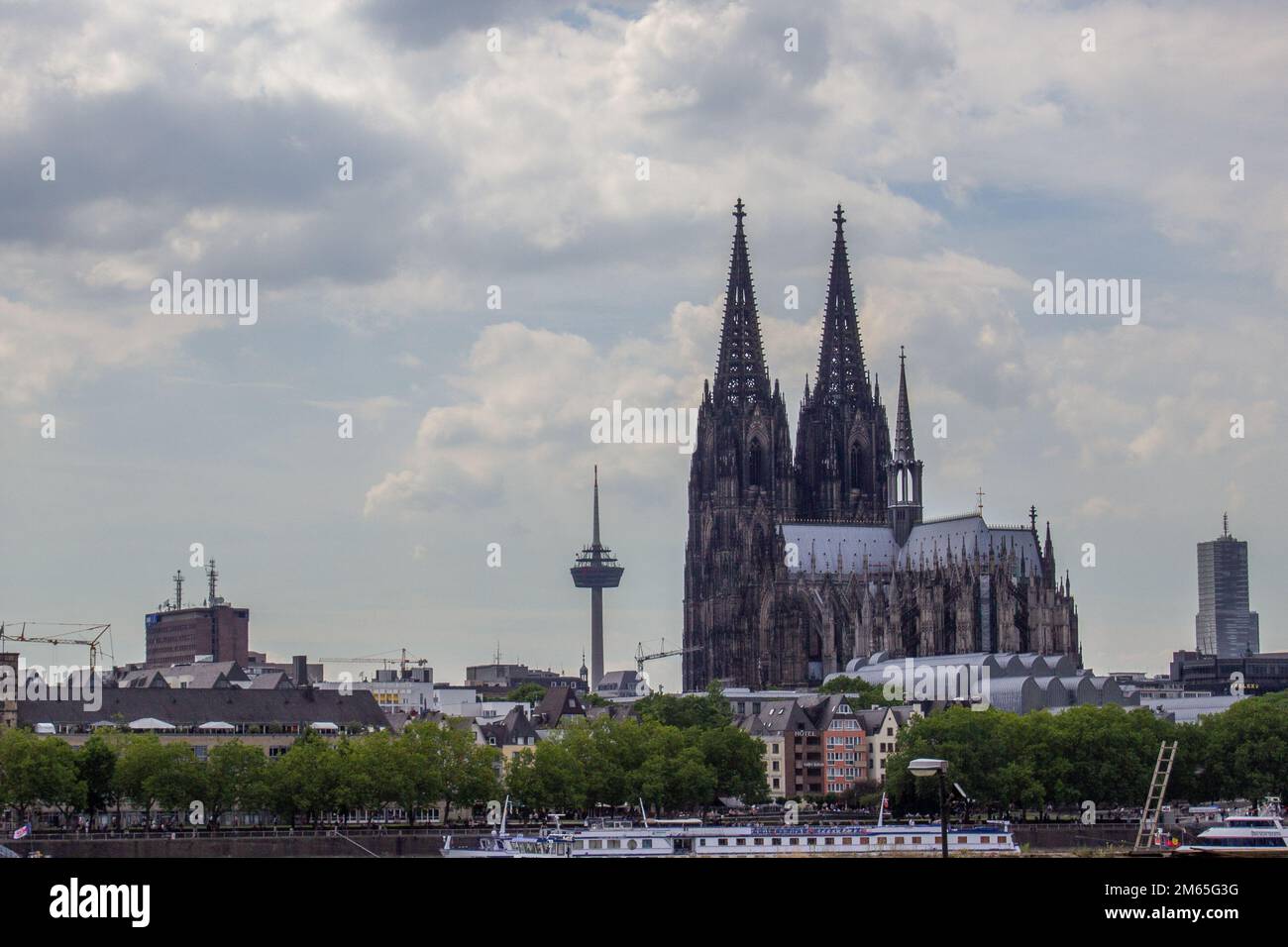 Cityscape of Cologne with Hohenzollern bridge, cathedral, Saint Martin ...