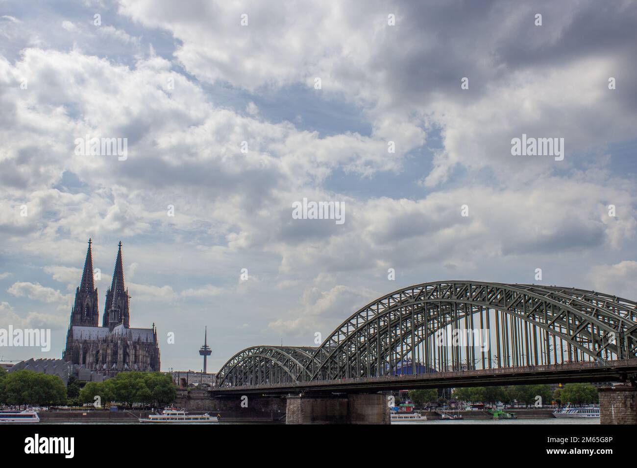 Cityscape of Cologne with Hohenzollern bridge, cathedral, Saint Martin ...