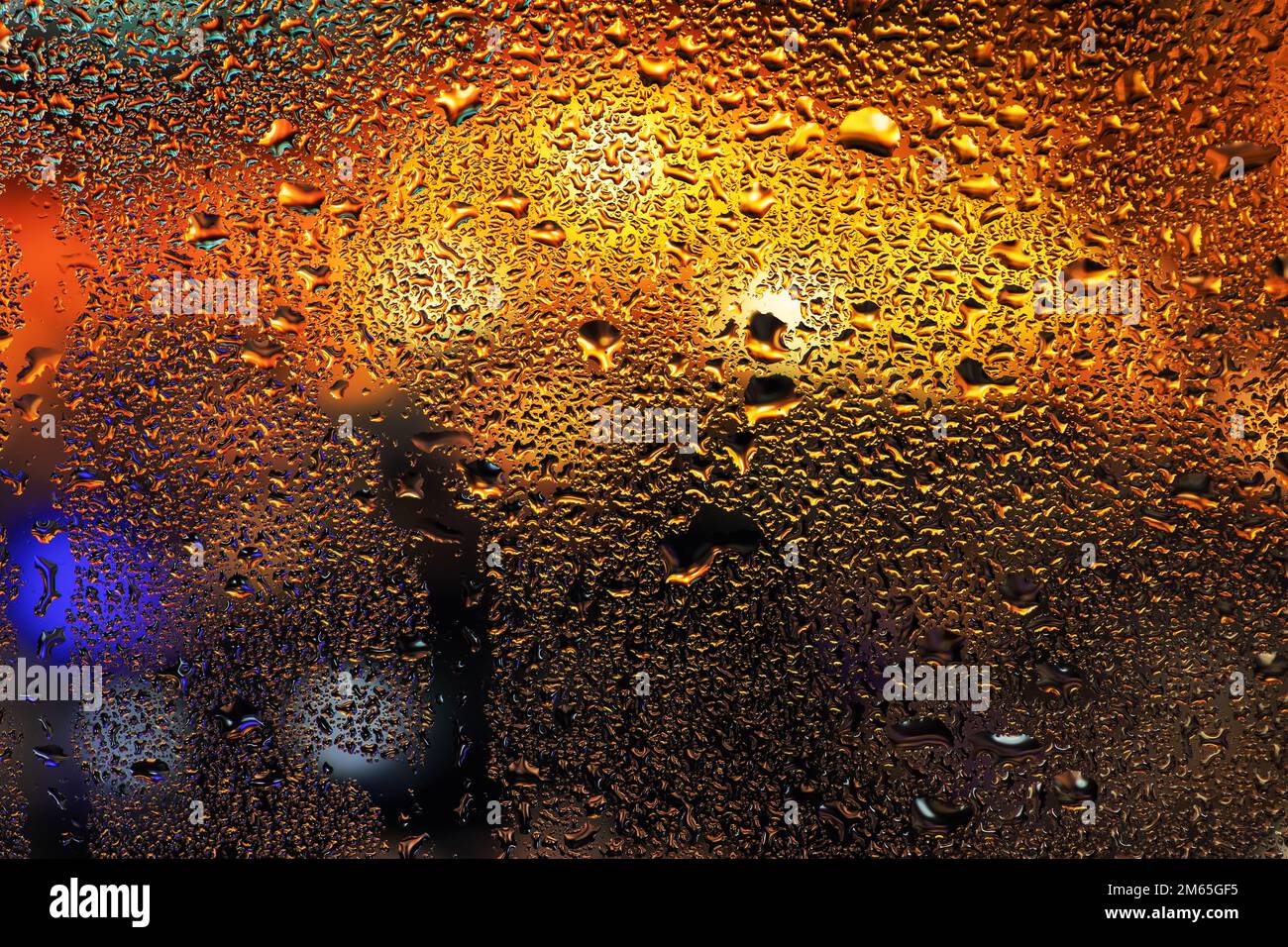 Water drops and condensation in a window glass. Abstract background ...