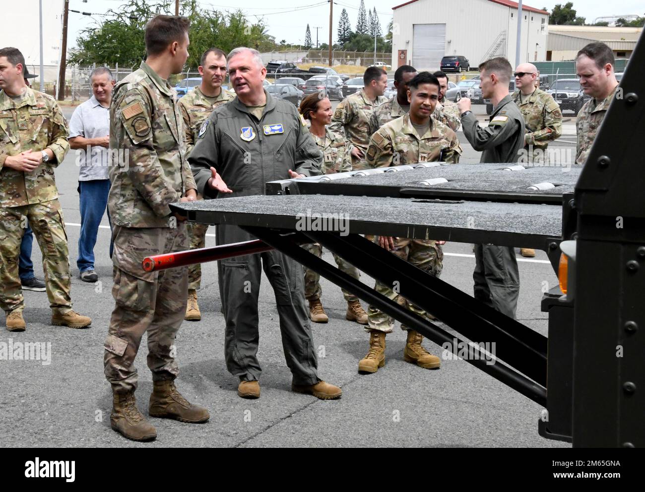 Senior Airman Grady Mark (left), 735th Air Mobility Squadron, describes ...