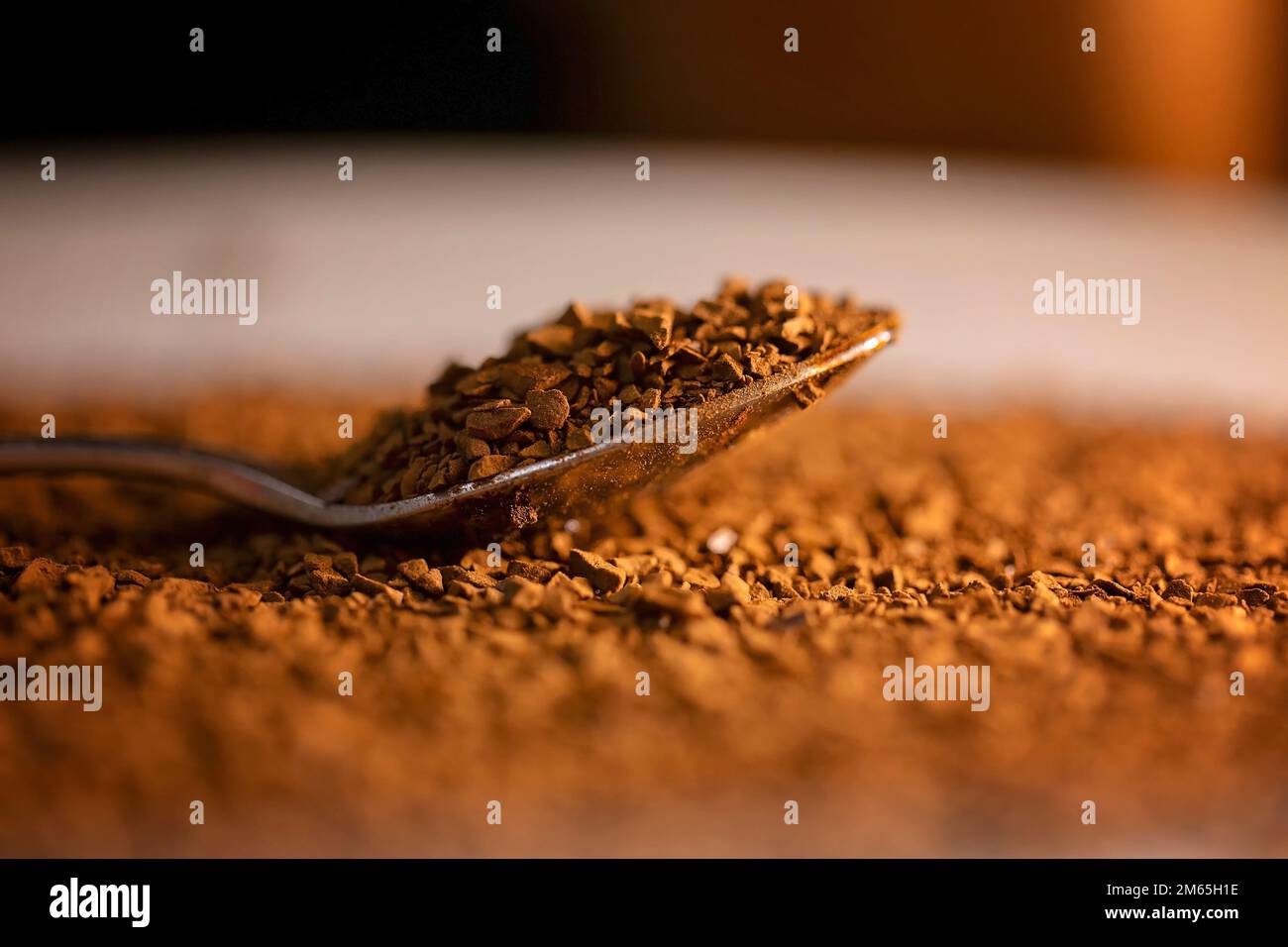 Instant Coffee granules shot in soft beautiful lighting with a silver ...