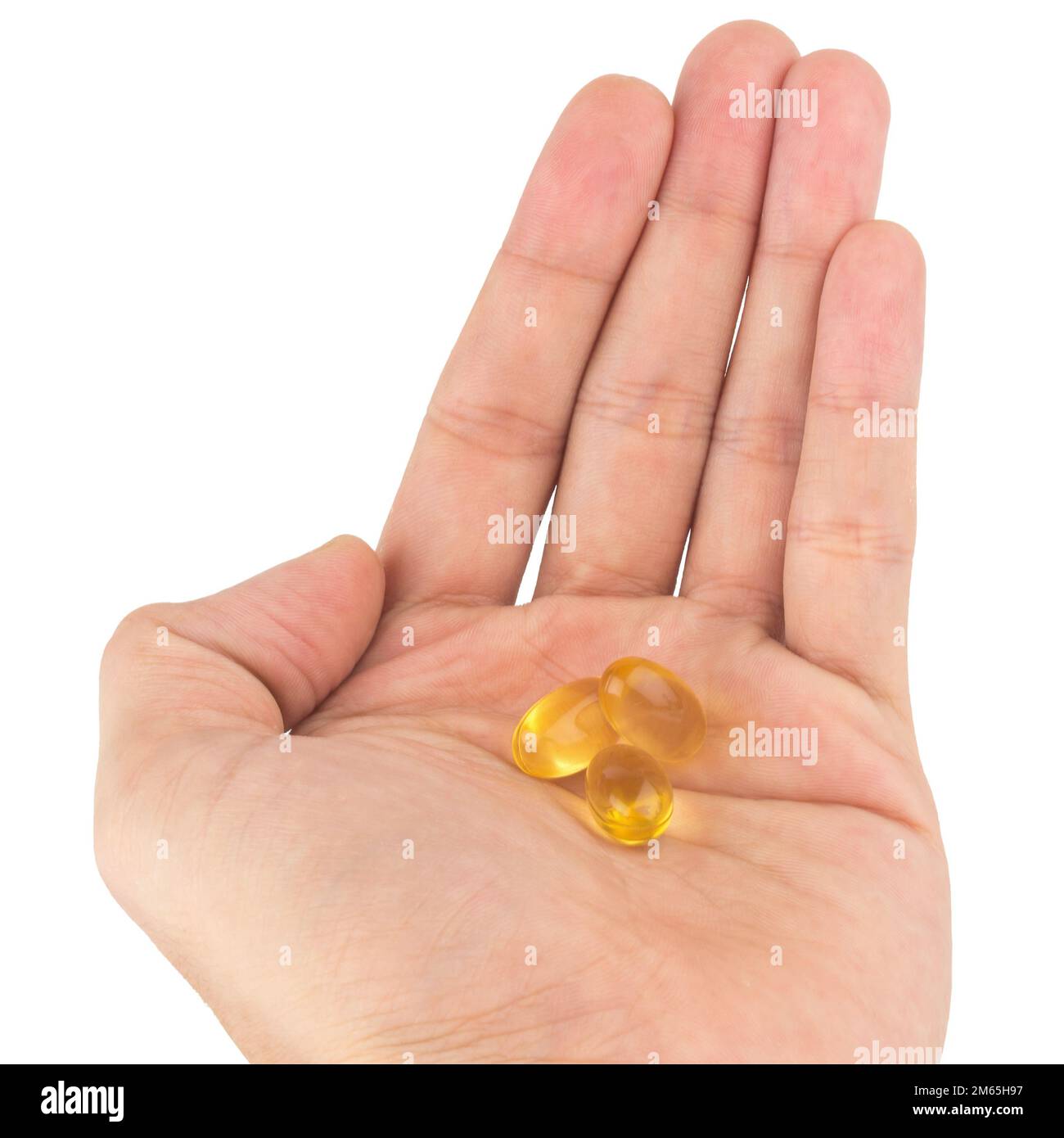 hold fish oil eating Capsules fish oil isolate on white background ...