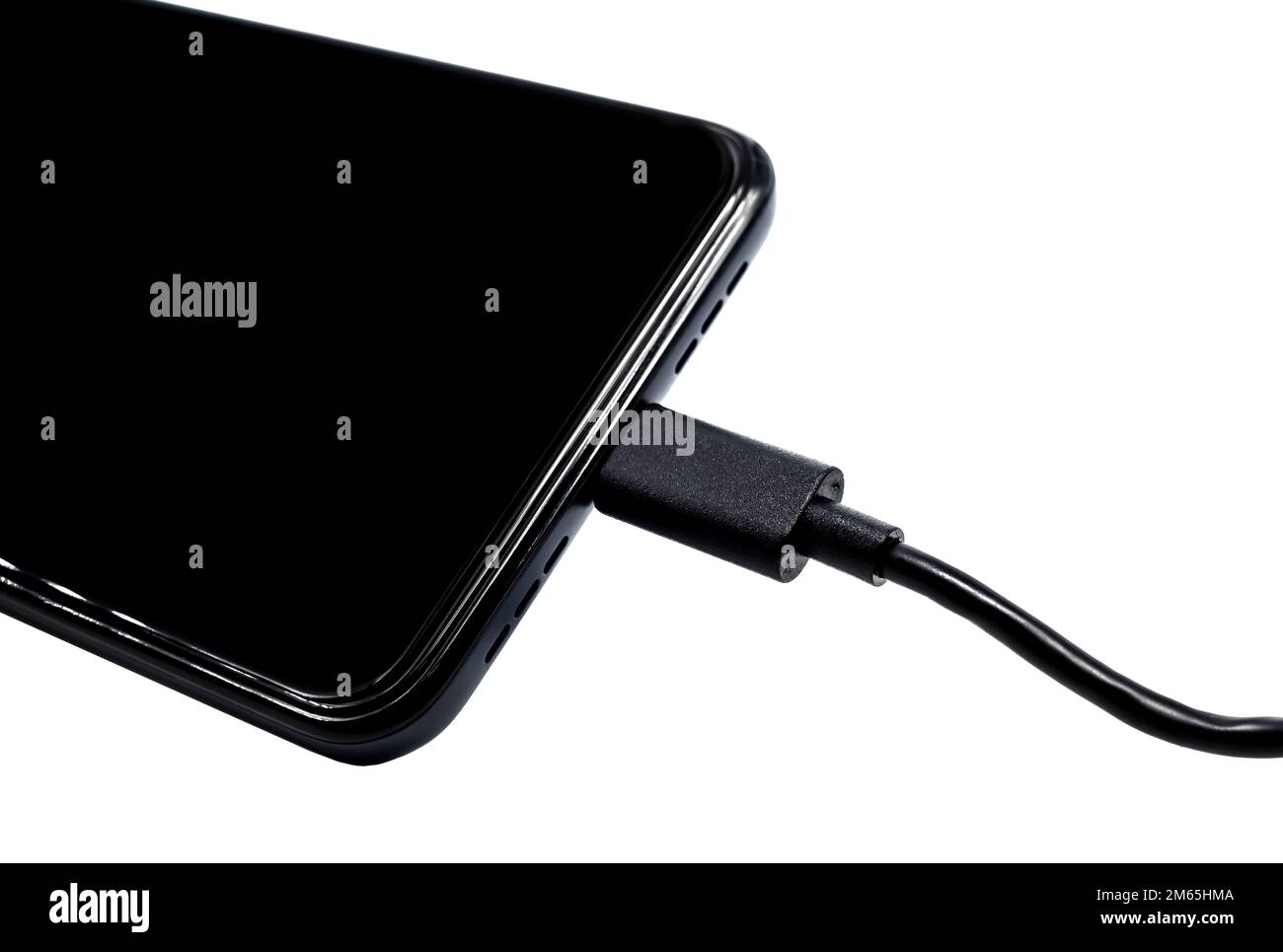 Smartphone charging via usb cable on a white background. Wired charging ...