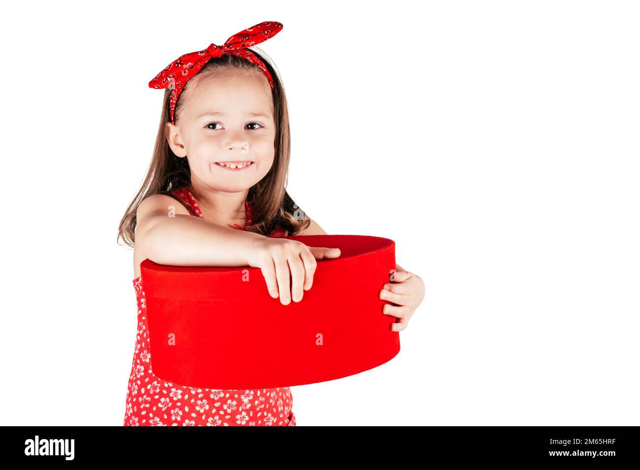 Happy little girl with smile hold big red present box. Portrait of ...