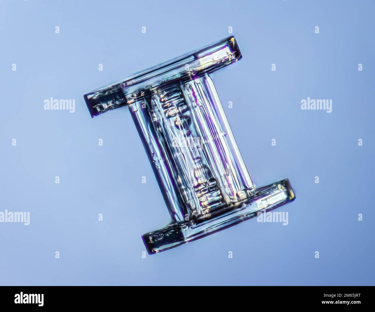 Real column snowflake at high magnification. Macro photo of small ...