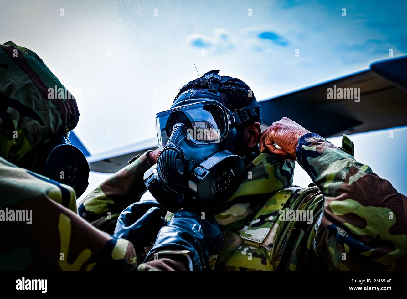 A U.S. Air Force Airman from the 305th Air Mobility Wing puts on ...