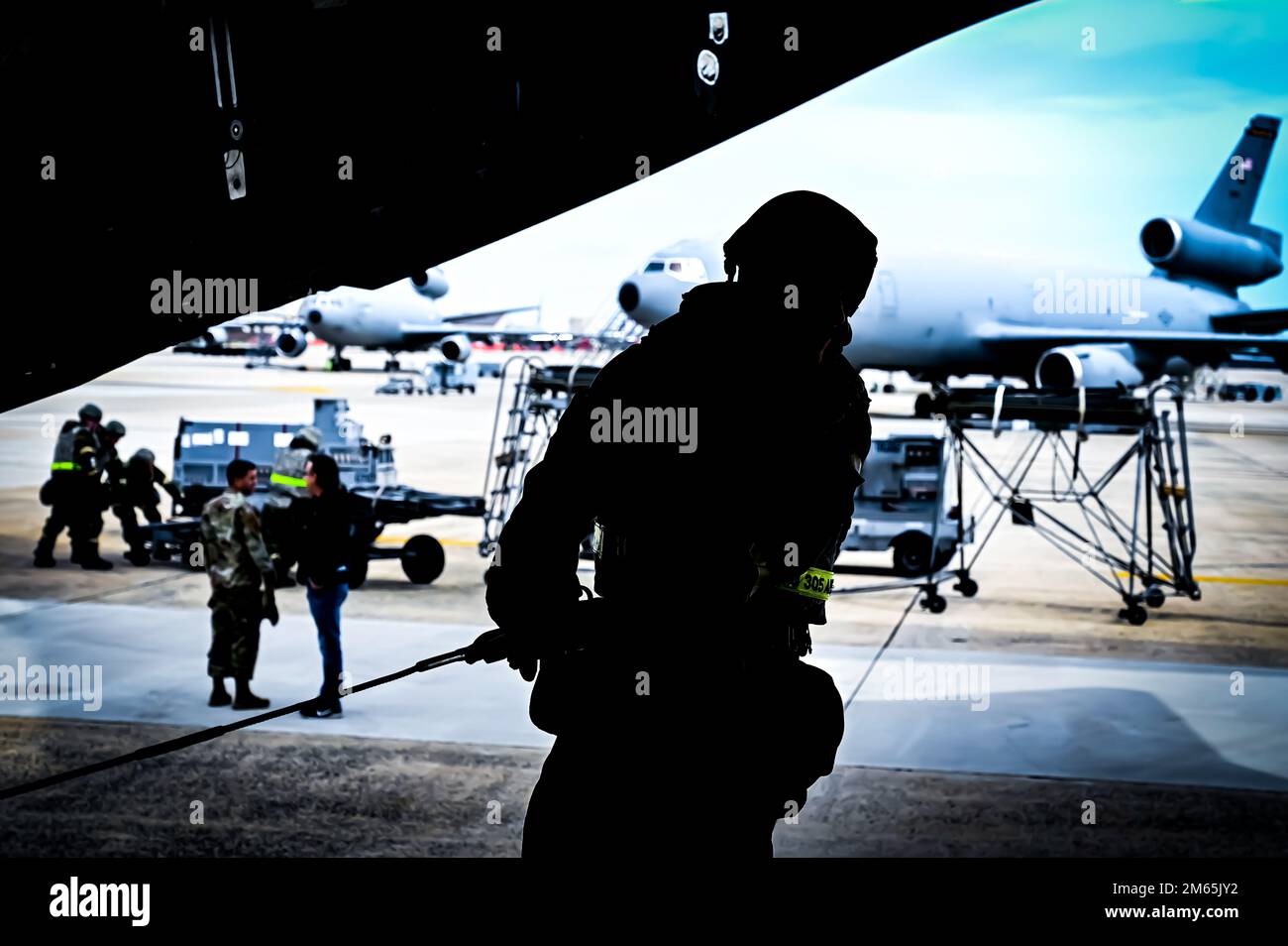 A U.S. Air Force Airman from the 305th Air Mobility Wing wearing ...