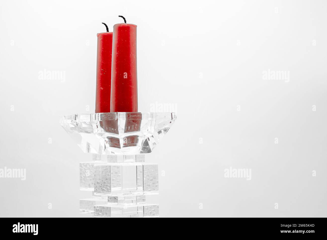 two red candles in clear glass sculptured candle holders Stock Photo ...