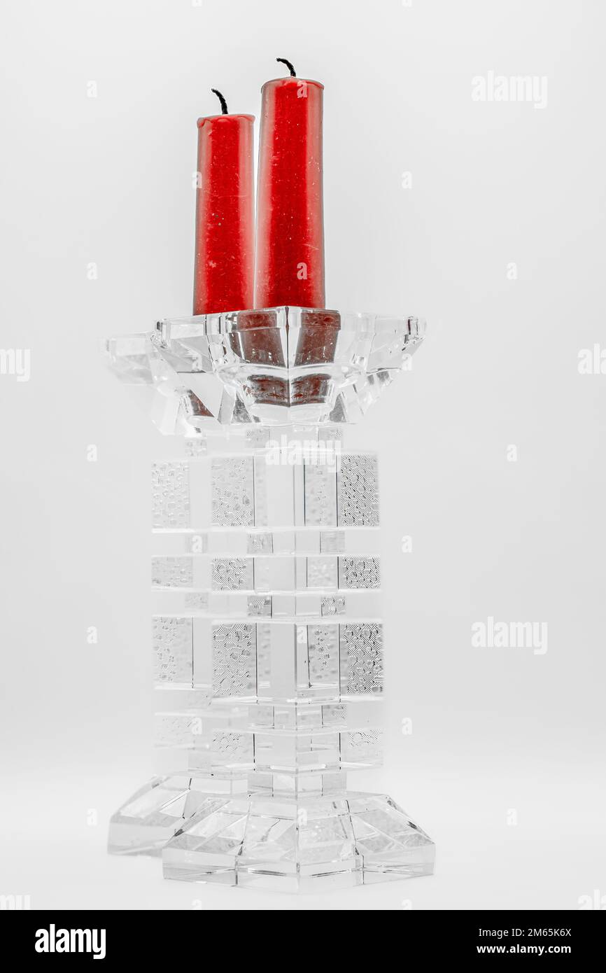 two red candles in clear glass sculptured candle holders Stock Photo ...
