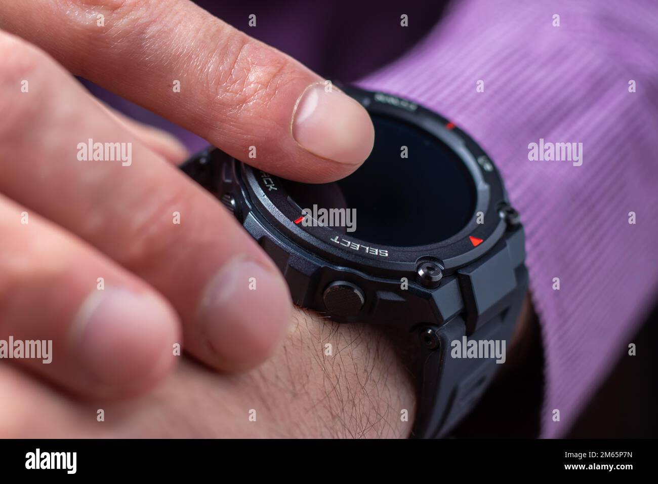 Close up shot of a man hand that uses a smart watch to view incoming ...