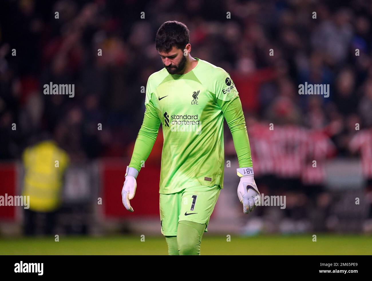 Liverpool goalkeeper Alisson Becker reacts after conceding a second ...