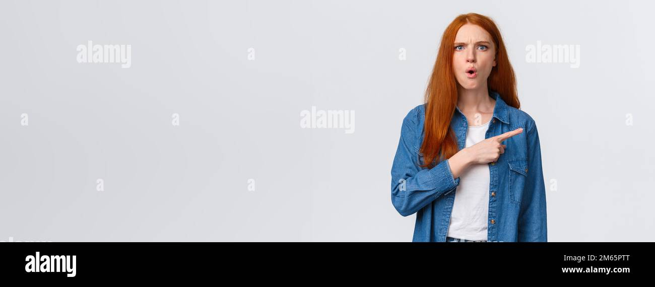 What is that. Displeased, tensed and mad frustrated redhead bossy woman ...