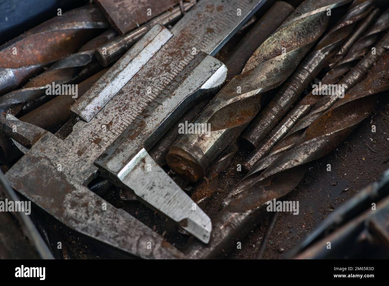 old vintage hand tools - set of drills and old caliper on a iron ...