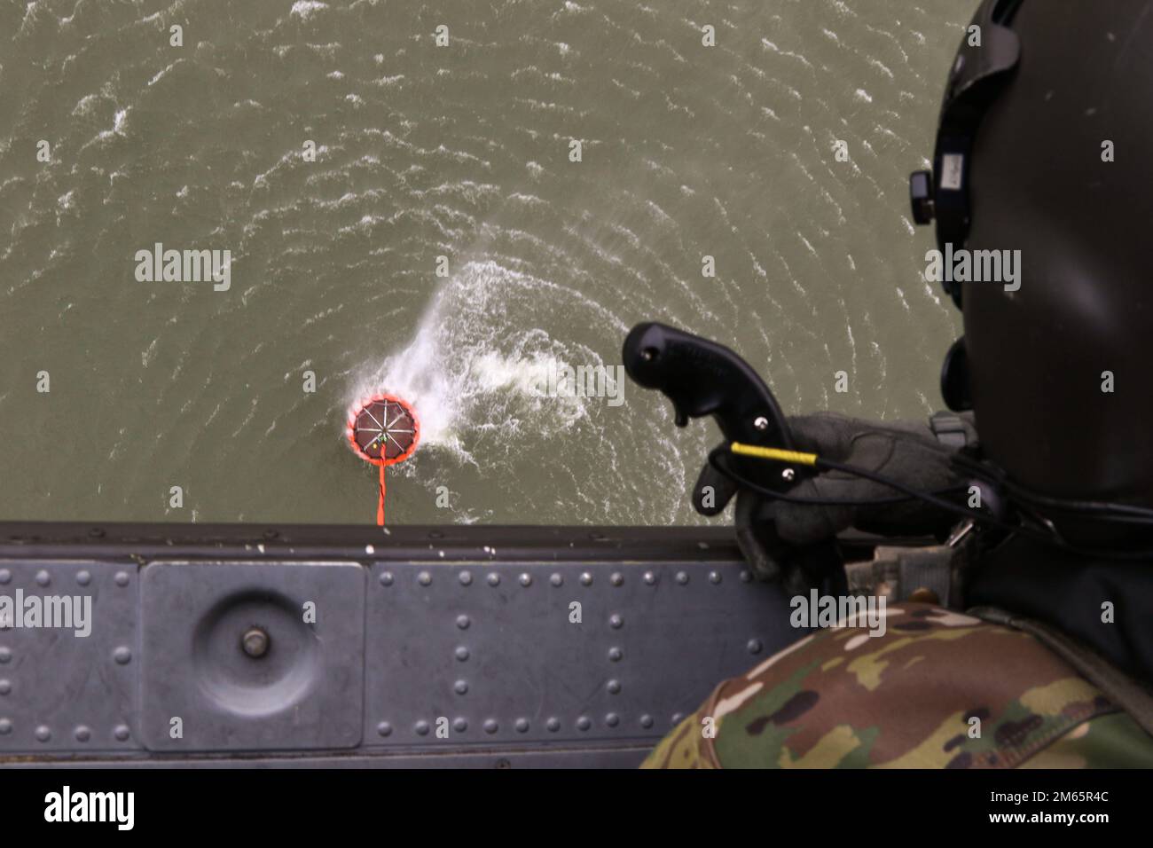 Sgt. 1st Class Kyle Moyer, a UH-60M Black Hawk helicopter crew chief ...
