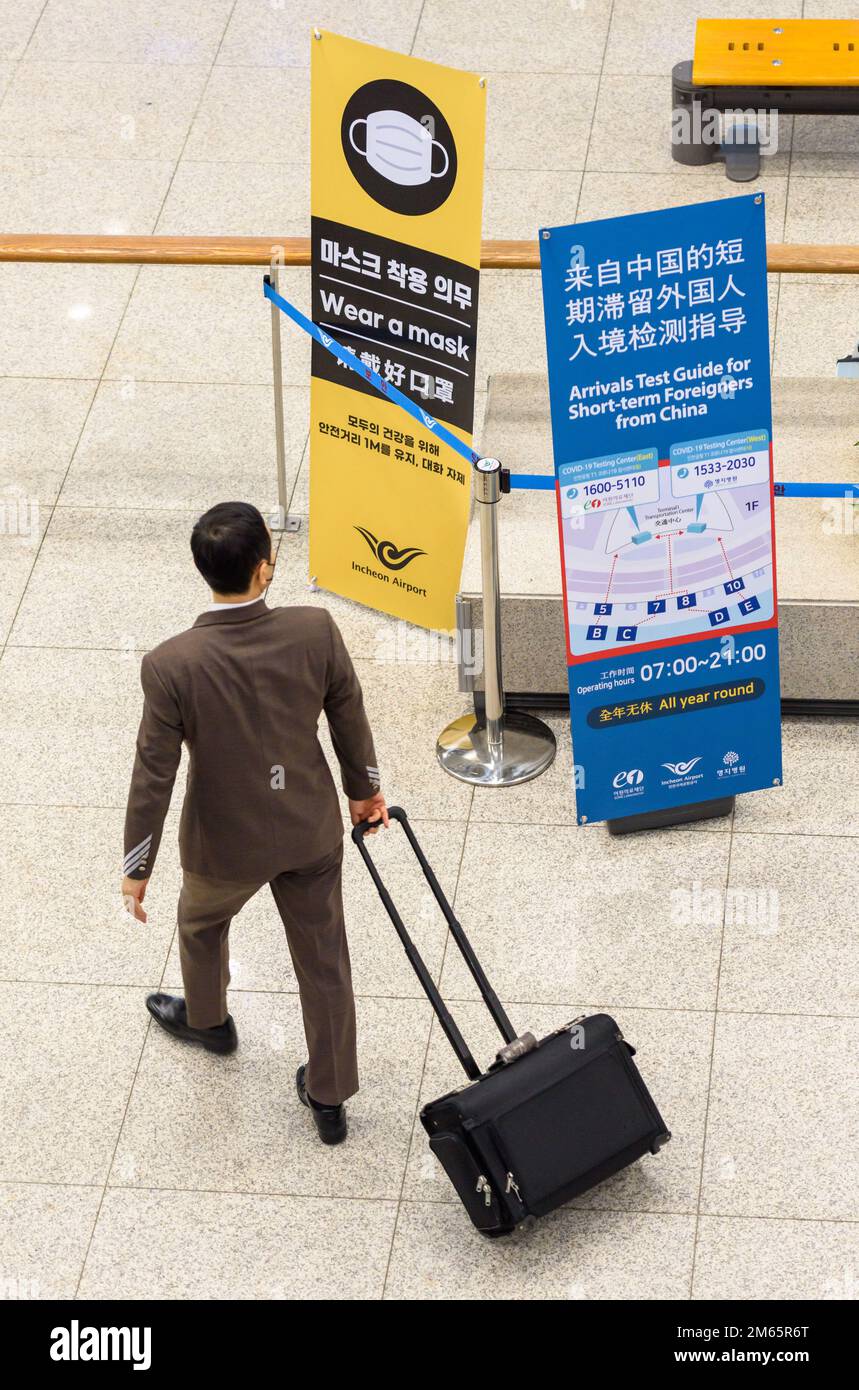 Incheon, South Korea. 02nd Jan, 2023. An airline staff passes the ...