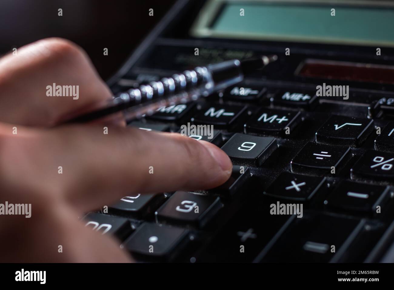 Close up businessman hand using calculator calculate about finance ...