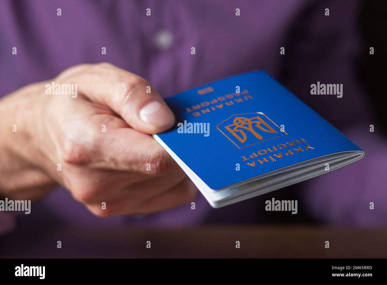 New Ukrainian Blue Biometric Passport With Identification Chip In Hands