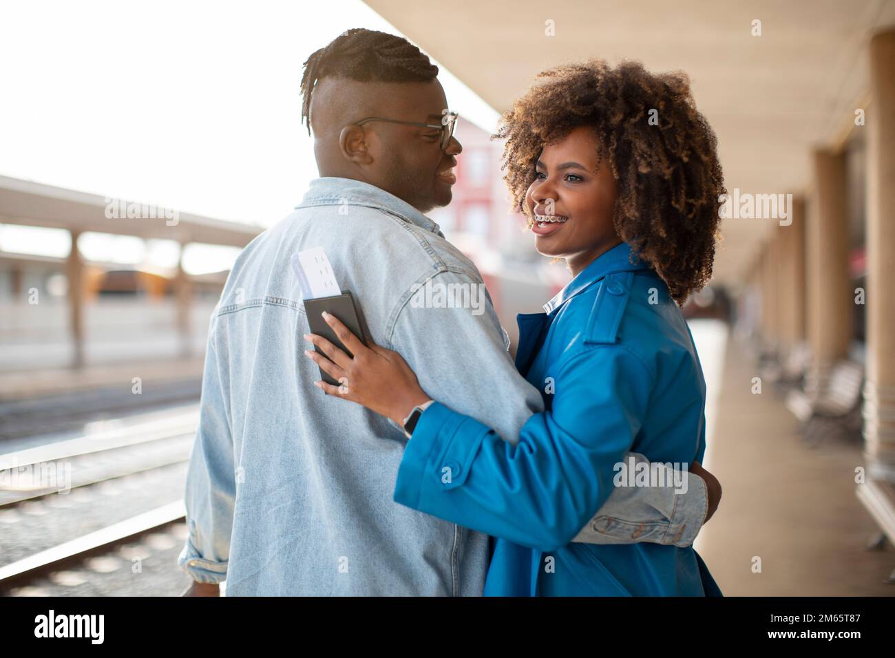Portrait Of Happy Black Couple Embracing At Railway Station Stock Photo ...