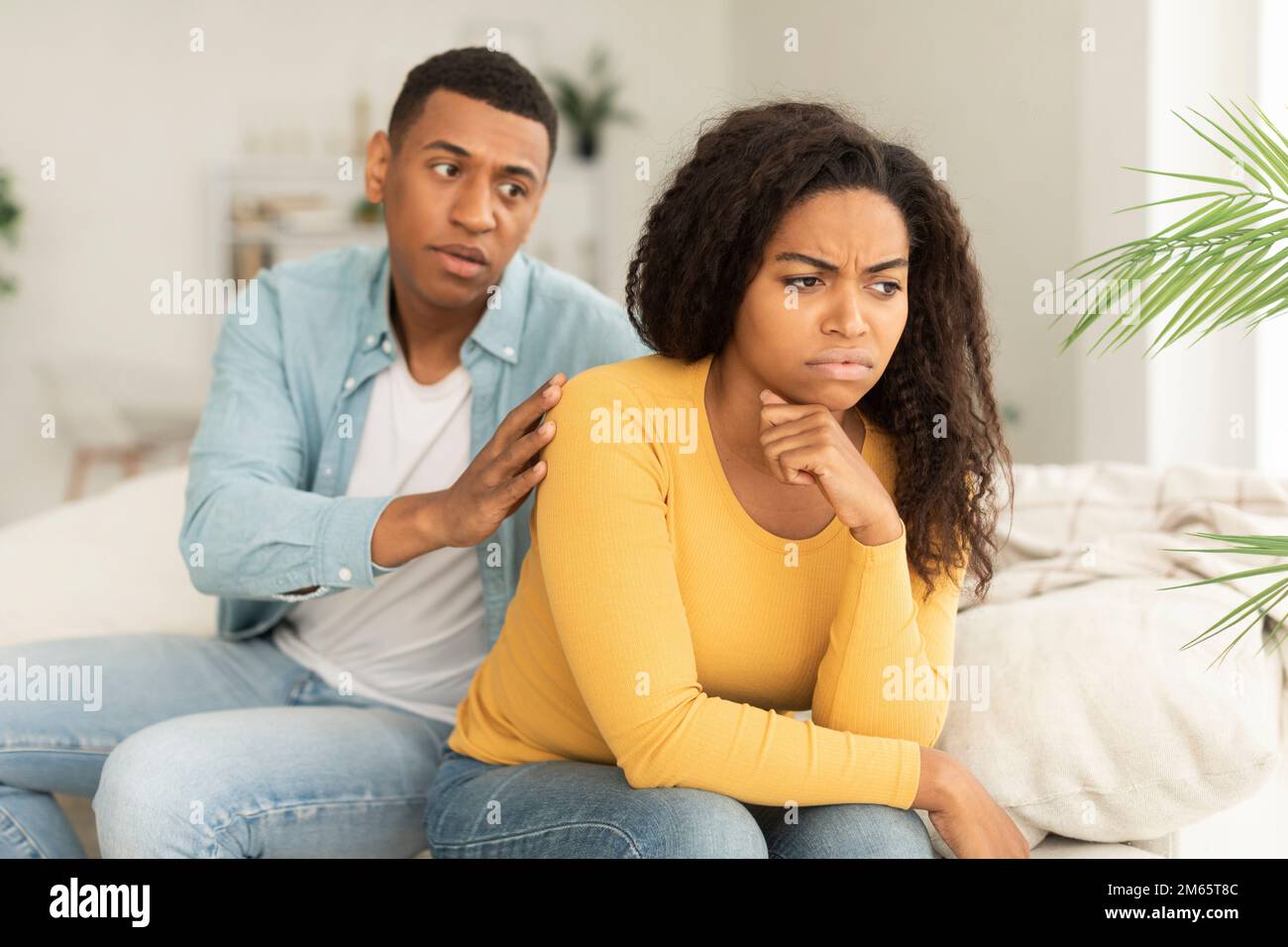 Sad husband calms offended upset millennial african american wife ...
