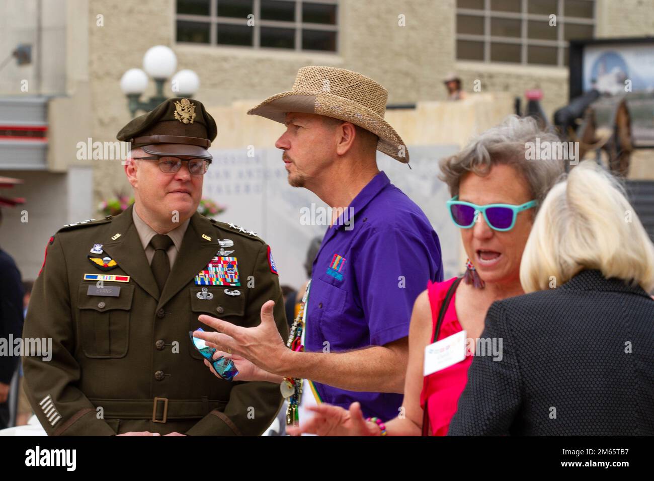 U.S. Army Lt. Gen. John Evans, commanding general of U.S. Army North, speaks with an attendee at ...