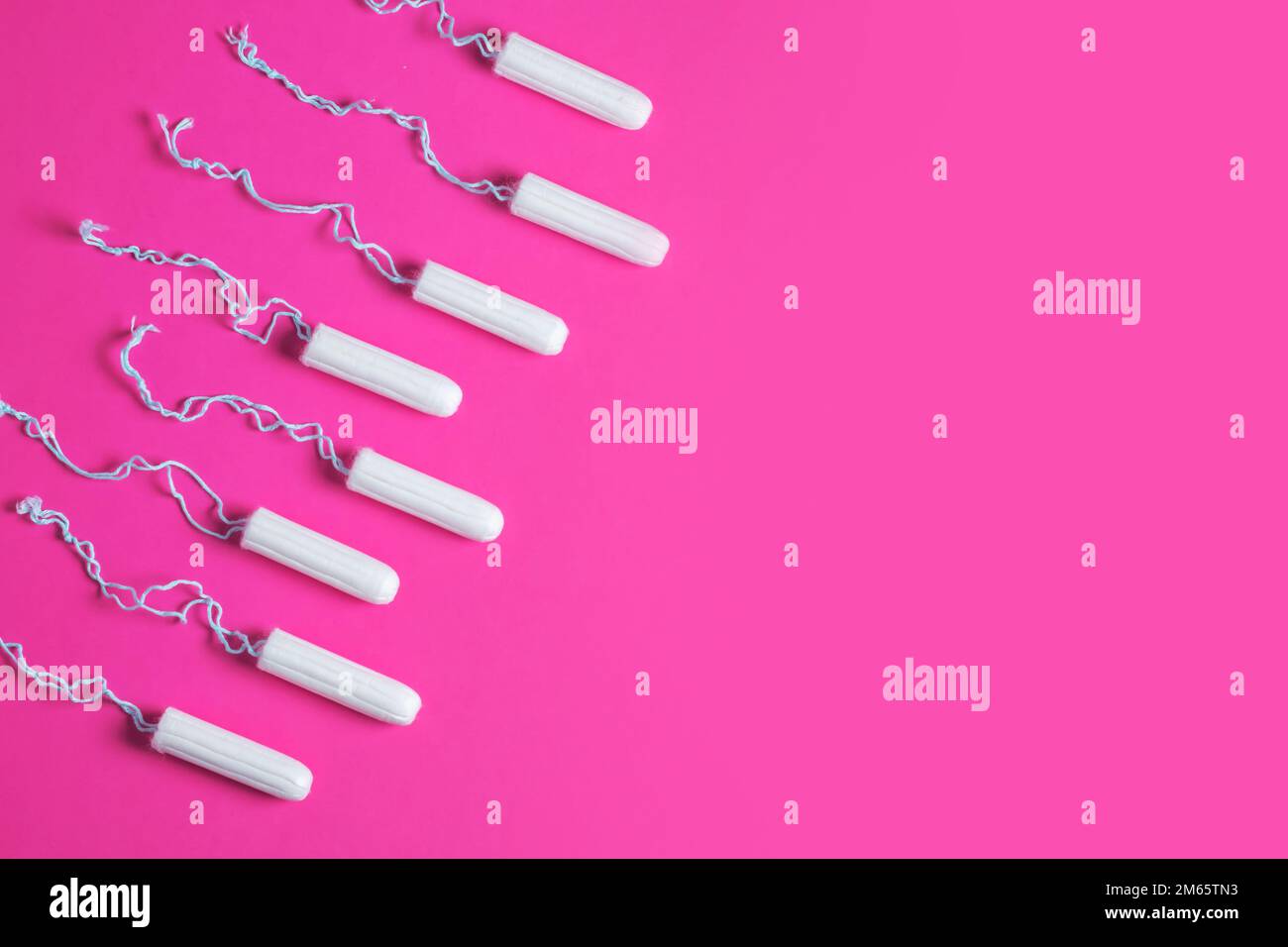 Menstrual period concept. Woman hygiene protection. Cotton tampons on ...