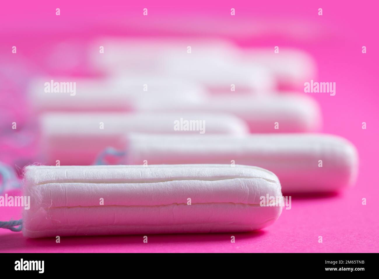 Medical female tampon close up on a pink background. Hygienic white ...