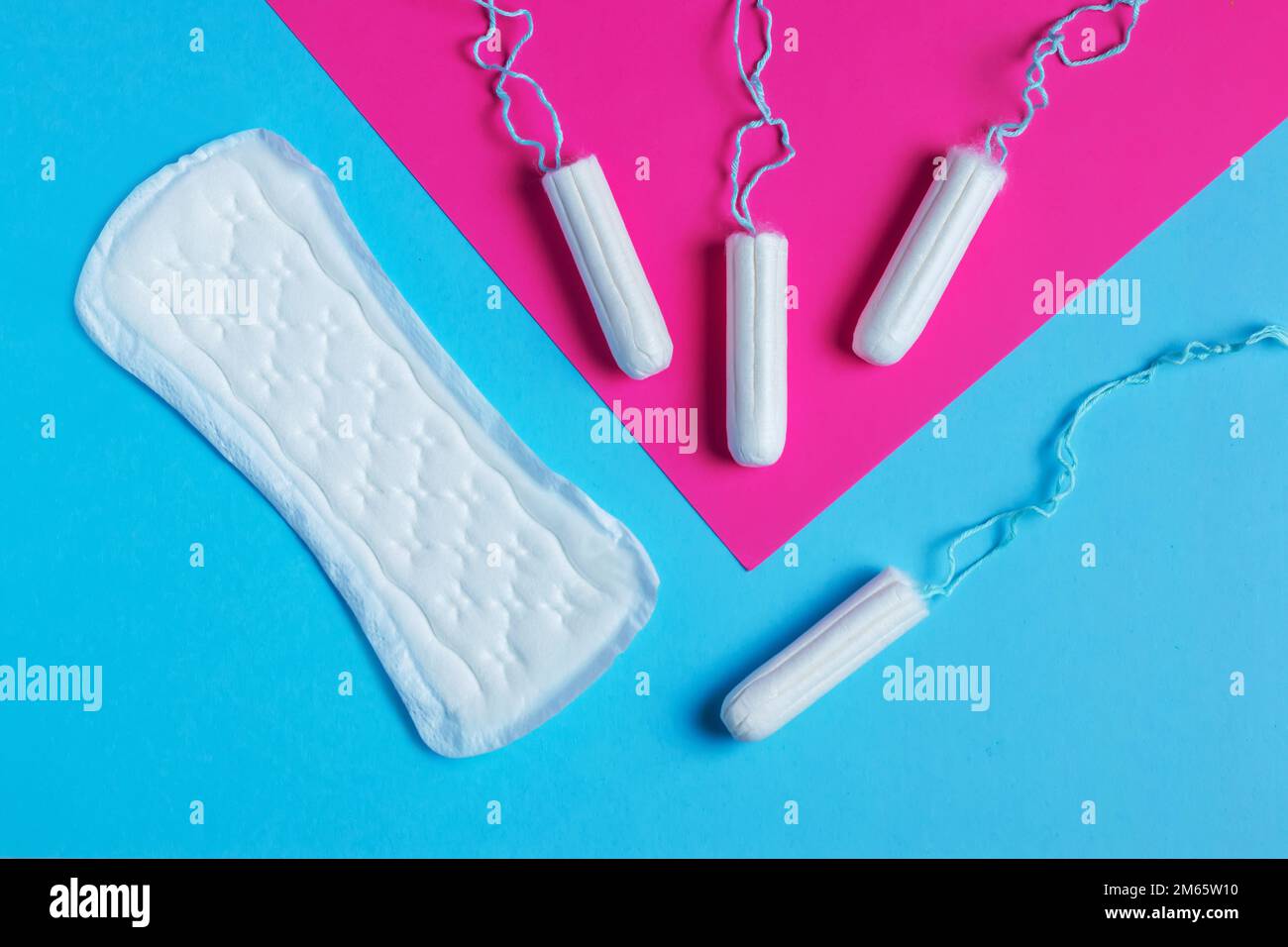 women pads and tampon - sanitary pads lies next to a tampon on an ...