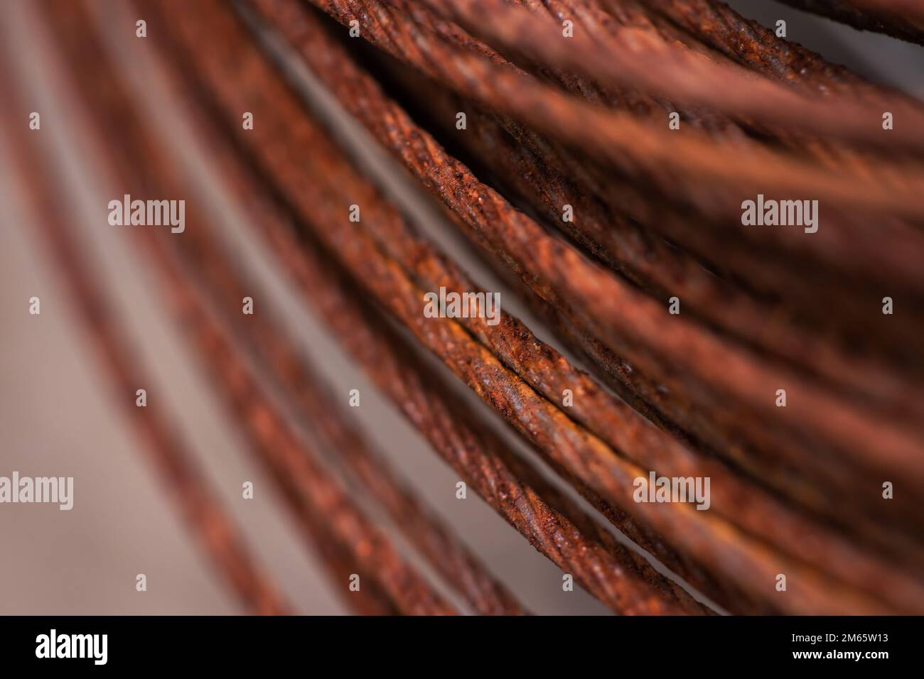 Round rusty steel wire coils. Metal reels for further industrial ...