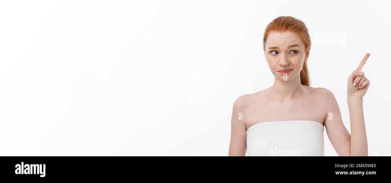 Portrait of caucasian cute in concern and shock, pointing index finger ...