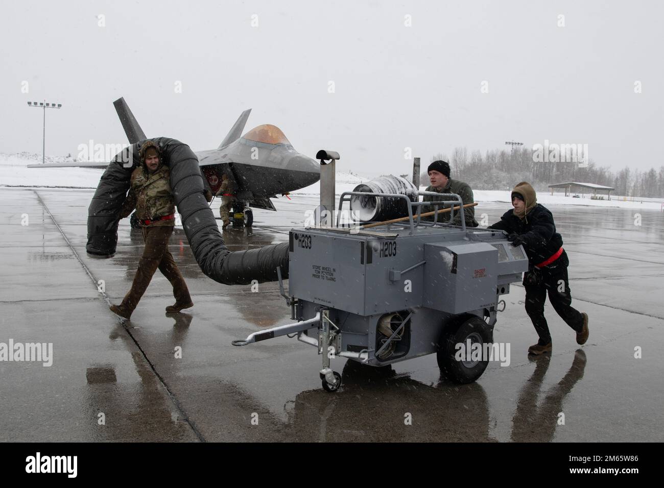 U.S. Airmen assigned to the 3rd Aircraft Maintenance Squadron move a ...