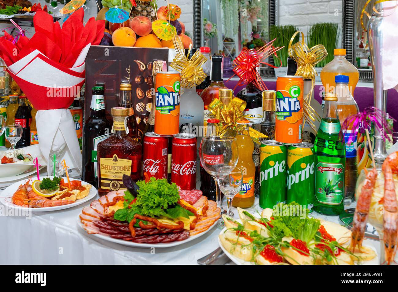 Many alcoholic and non-alcoholic drinks on the festive table. A variety ...