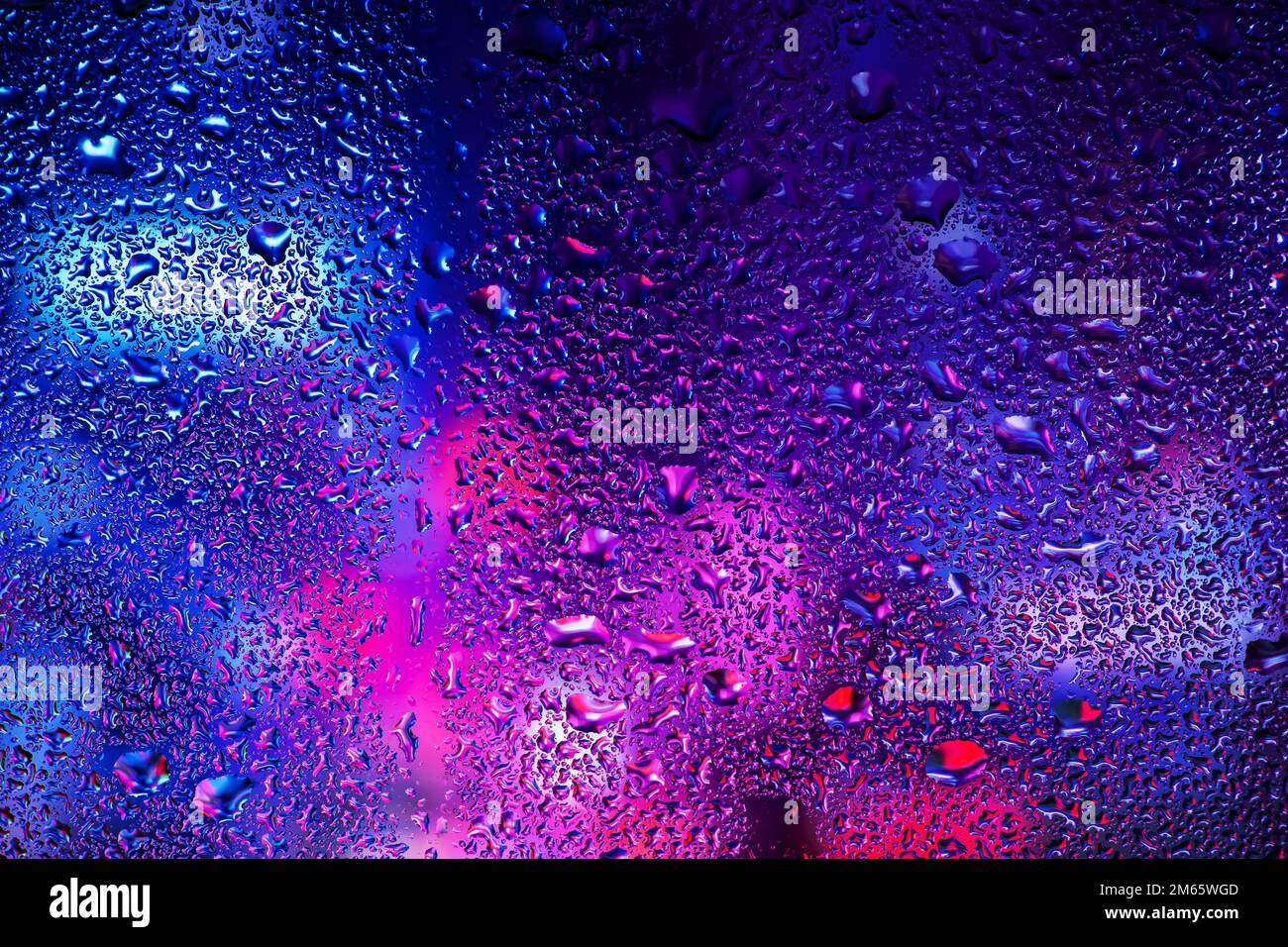 Rain drops and condensation on the window glass against the background ...