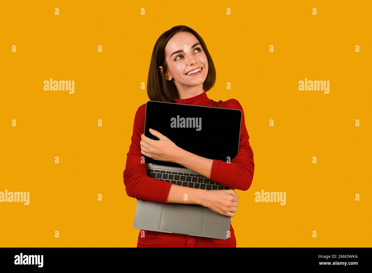 Beautiful young brunette black laptop hi-res stock photography and images - Alamy