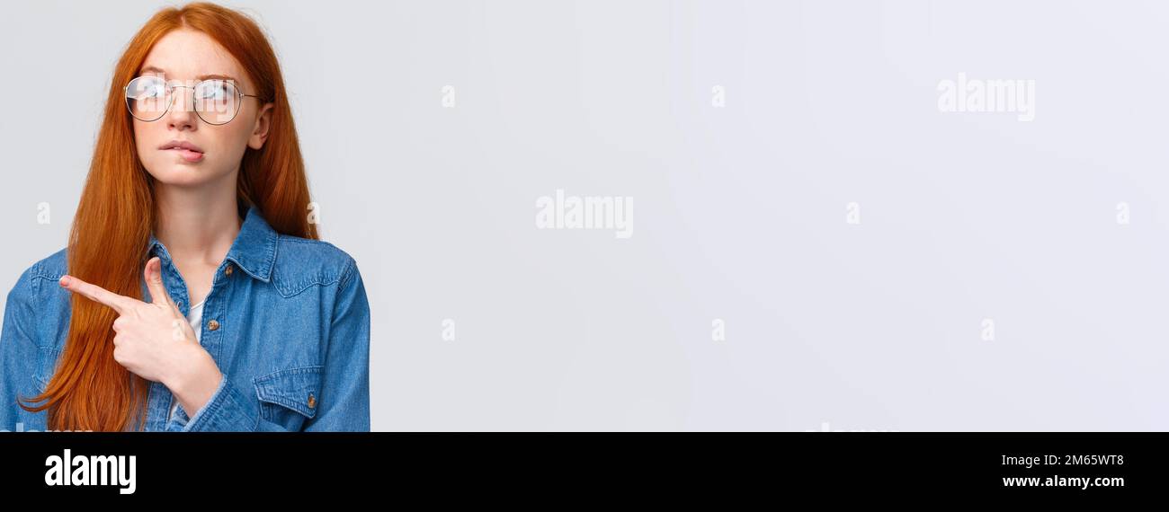 Unsure smart and cute redhead teenager in glasses, female student ...