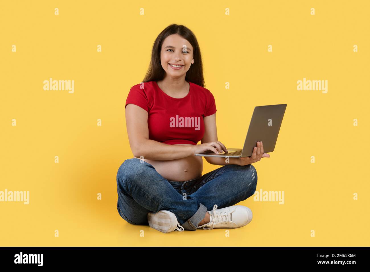 Remote Work During Pregnancy. Happy Pregant Female Sitting On Floor ...