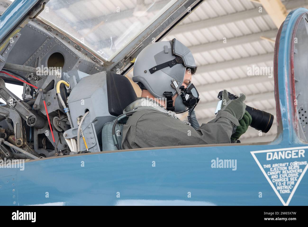 Airman 1st Class Joseph Garcia, 509th Public Affairs, checks his camera ...