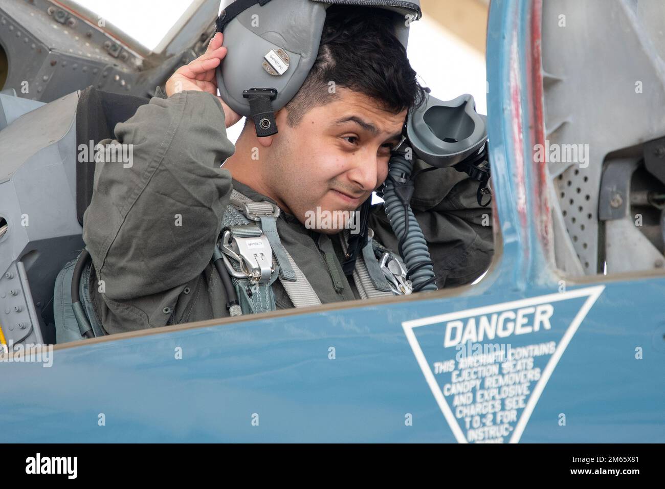 Airman 1st Class Joseph Garcia, 509th Public Affairs, puts his helmet ...